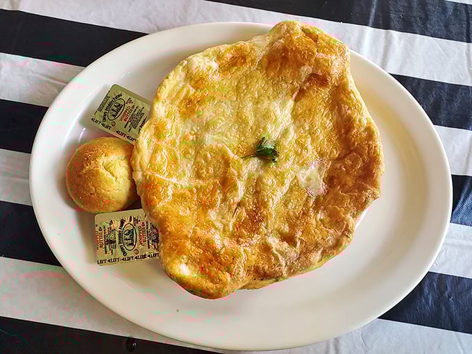 Chicken pot pie that looks like someone captured Sunday dinner and wrapped it in pastry – pure edible nostalgia.