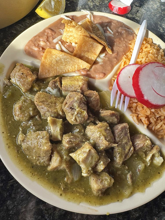 The chile verde showcases tender pork swimming in tangy green sauce – comfort food that warms you from the inside out.