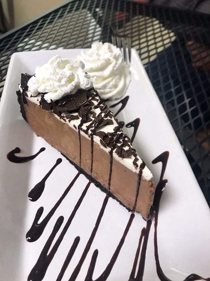 A chocolate mousse pie that doesn't just end your meal—it provides closure, therapy, and possibly the meaning of life.