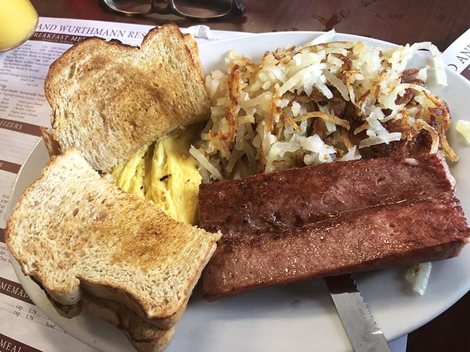 The breakfast plate that launched a thousand road trips—eggs, hash browns, and toast arranged with the casual perfection of a still-life painting.