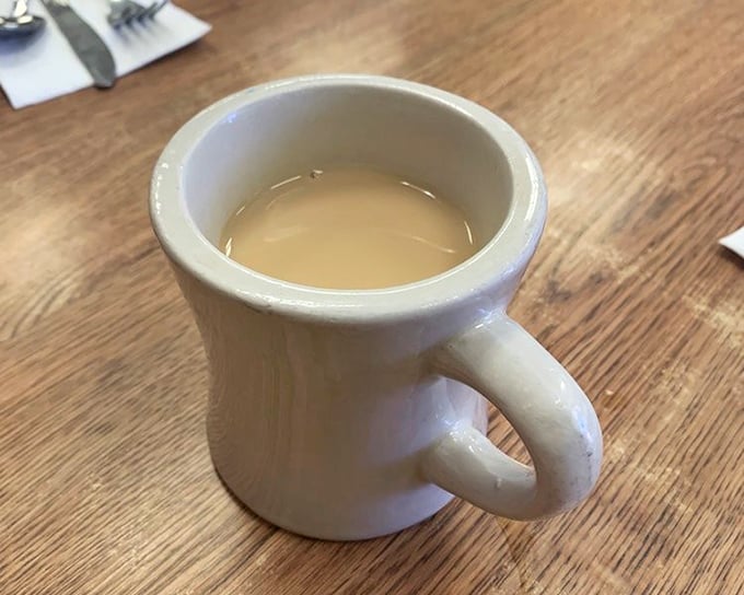 The humble coffee mug—unassuming vessel of liquid motivation. Not artisanal or single-origin, just honest coffee that knows its job and does it well.