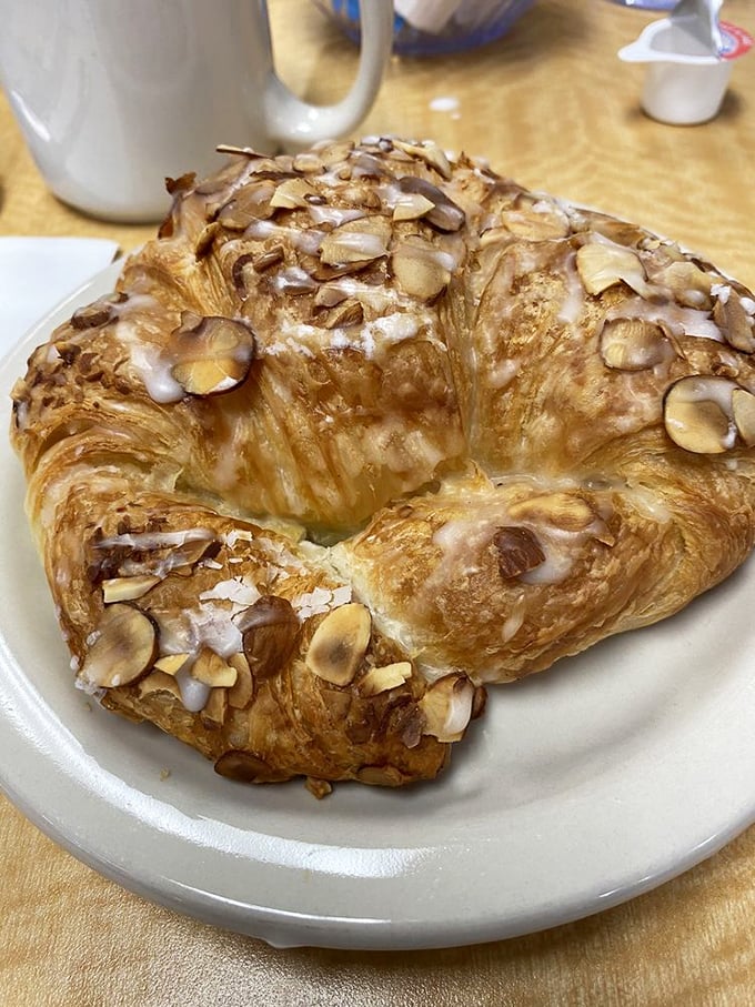 This almond croissant isn't just breakfast—it's architecture, engineering, and butter-based artistry that would make any French baker nod in approval.
