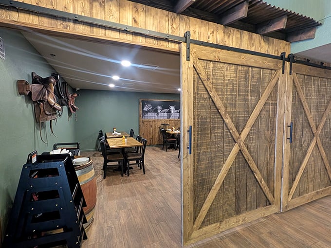 Rustic barn doors lead to private dining spaces where memories are made, one perfectly grilled bite at a time.