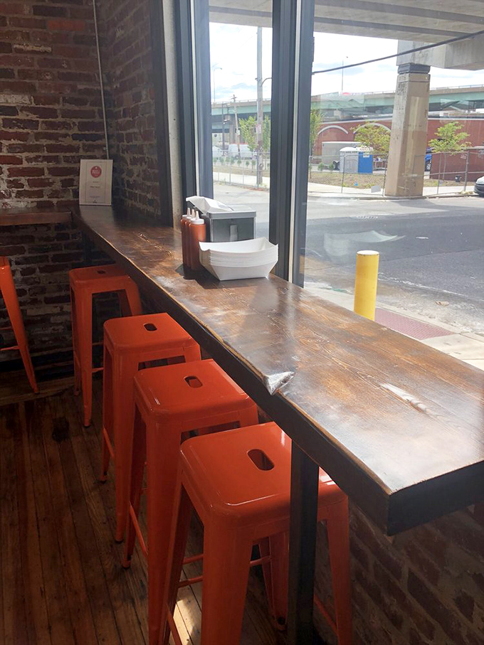 Window seats with bright orange stools—the perfect perch for people-watching while contemplating whether to order seconds or save room for pie.