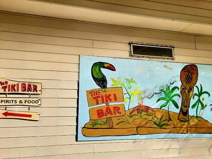 Follow the toucan to happiness! This cheerful mural isn't just decoration – it's a promise of the good times waiting inside.