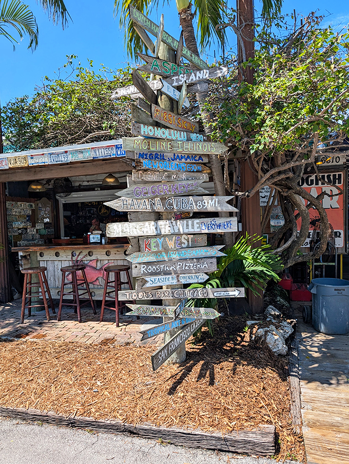 This isn't just directional signage – it's a wooden representation of the Hogfish philosophy: all roads lead to good food and good times.