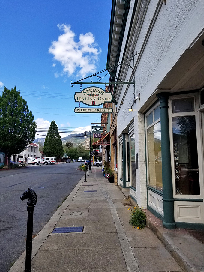 Strings Italian Cafe beckons hungry visitors with the promise of pasta and mountain views – small-town dining with big-hearted flavor.