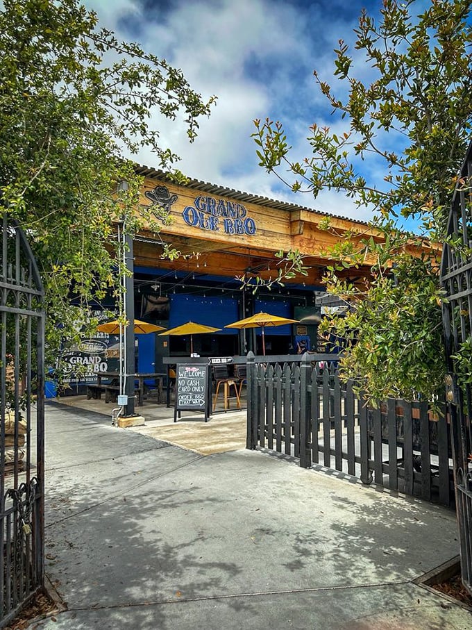 The entrance to Grand Ole BBQ—like the gates to a carnivore's paradise. Those trees provide shade for the line that will inevitably form before opening.