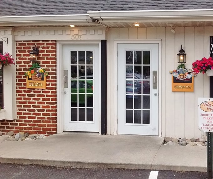 The entrance says it all—"Welcome" signs flanking French doors that might as well be portals to comfort food heaven. Your diet plan can wait in the car.