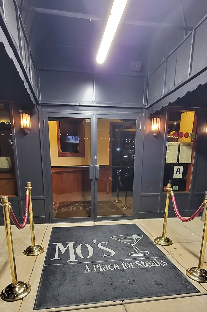 The entrance sets the tone: you're not just walking into a restaurant, you're stepping onto a culinary red carpet. The velvet ropes aren't keeping people out—they're building anticipation.