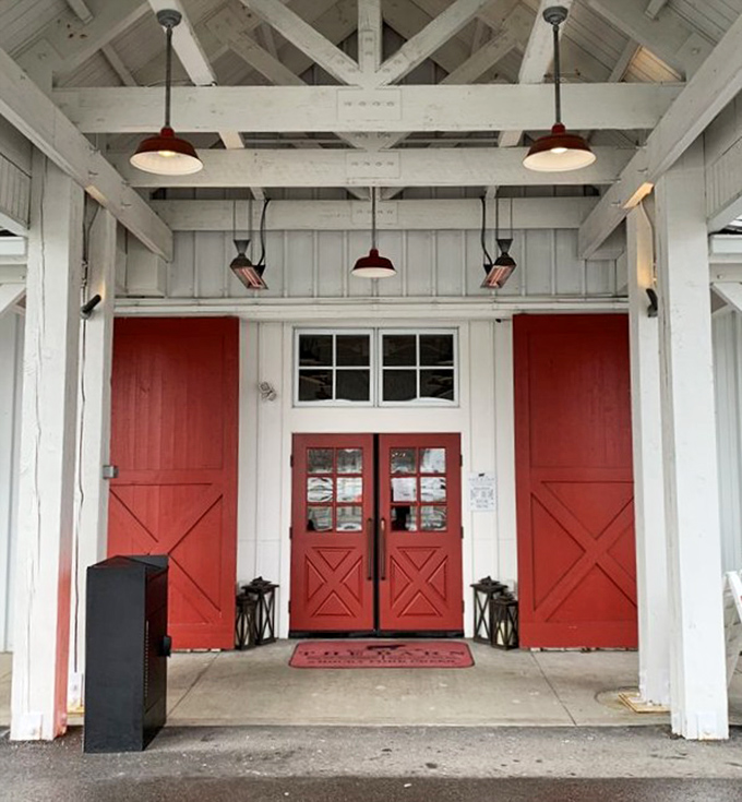 Those red barn doors aren't just an entrance—they're a portal to the kind of meal that creates memories and stretches waistbands.