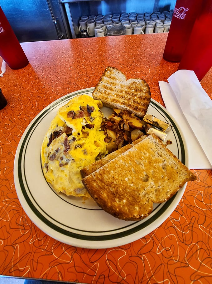 This omelet doesn't just satisfy hunger—it abolishes it. Perfectly executed breakfast classics that make chain restaurants weep with inadequacy.