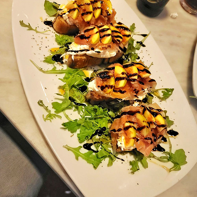 These bruschetta aren't just appetizers—they're edible art. The marriage of prosciutto, fig, and creamy cheese is nothing short of poetry.