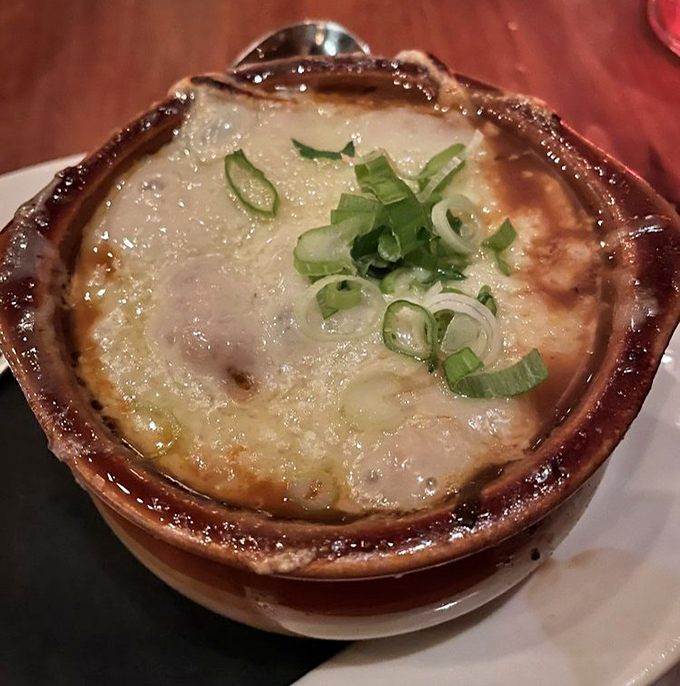 French onion soup that's worth the cheese pull. This bubbling crock of savory broth and gooey Gruyère demands a moment of silence.
