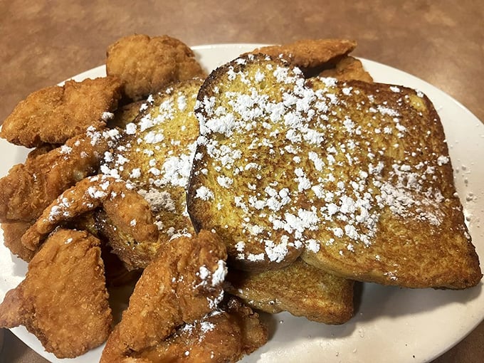 French toast dusted with powdered sugar alongside golden chicken tenders. The breakfast-meets-lunch combo that satisfies both your inner child and adult appetite.
