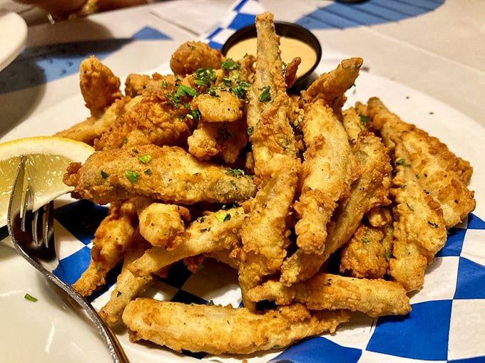 Crispy, golden fingers of the sea. These fried smelts aren't just appetizers—they're the opening act to a seafood symphony.