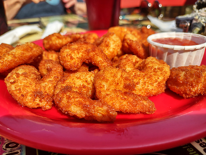 These crispy golden shrimp aren't just appetizers – they're little crescents of joy that disappear from plates faster than you can say "just one more."