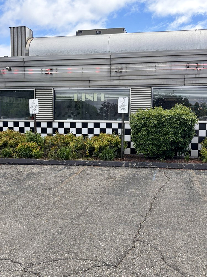 That checkered exterior trim isn't just decoration—it's a finish line flag signaling you've arrived at your comfort food destination.