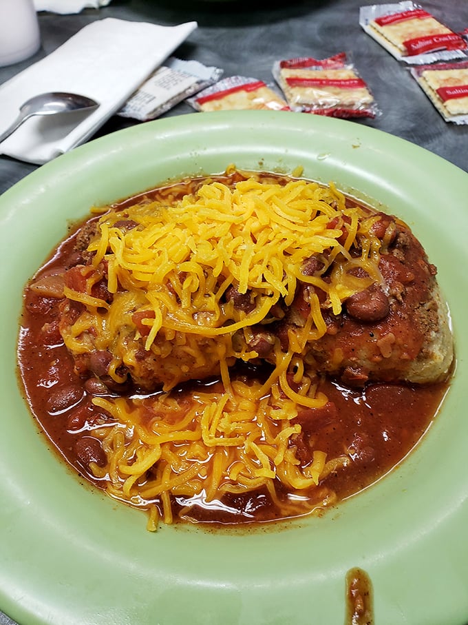 Chili and cheese: a relationship more dependable than most marriages. This hearty bowl doesn't just satisfy hunger—it banishes it to another dimension.