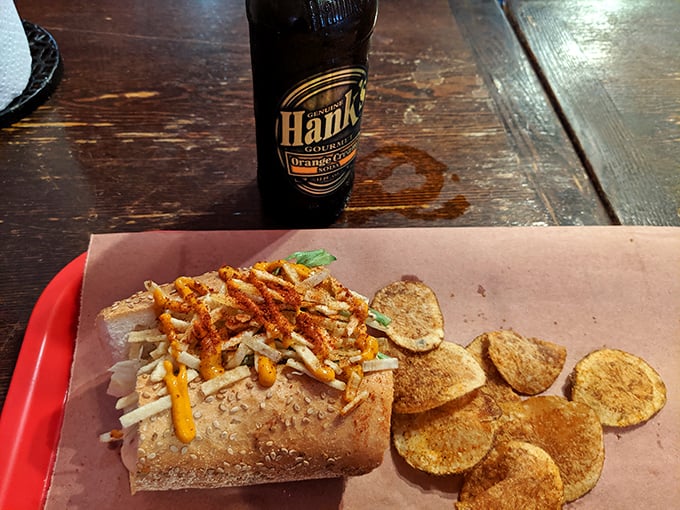 A sandwich that could only exist in Philly – where barbecue meets local tradition, served alongside house-made potato chips that shatter with each bite.