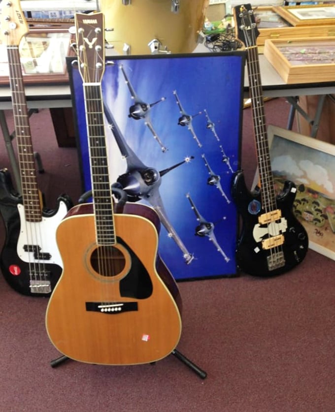 A Yamaha acoustic flanked by its electric cousins—like finding the Eagles, Hendrix, and Bootsy Collins all jamming at your local coffee shop.