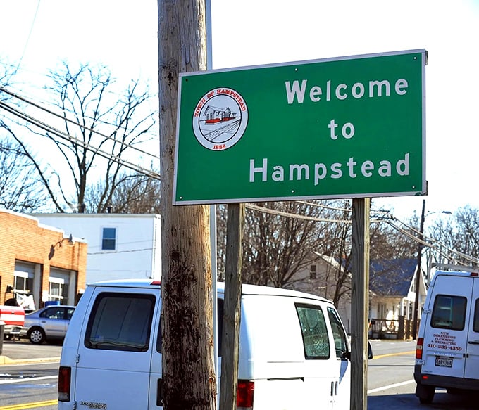 "Welcome to Hampstead" – a simple green sign that promises authentic small-town living just a short drive from the big-city hustle.