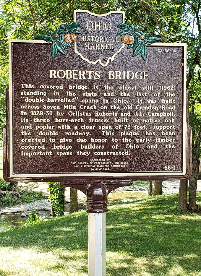 History stands still on this marker, telling the tale of Ohio's oldest covered bridge—a double-barreled span that's outlasted generations of travelers.