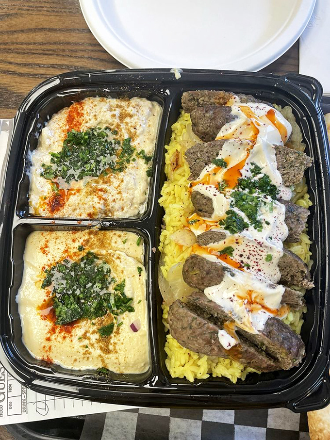 This isn't just a platter—it's a Middle Eastern feast in miniature, with hummus and kafta sharing space like old friends.