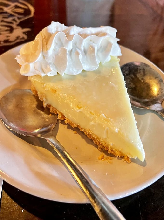 Key lime pie wearing a whipped cream crown, because in Florida, this dessert reigns supreme over all others.