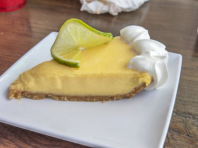 Key lime pie that makes you question why you've wasted time on other desserts. That dollop of whipped cream isn't optional—it's essential to the experience. 