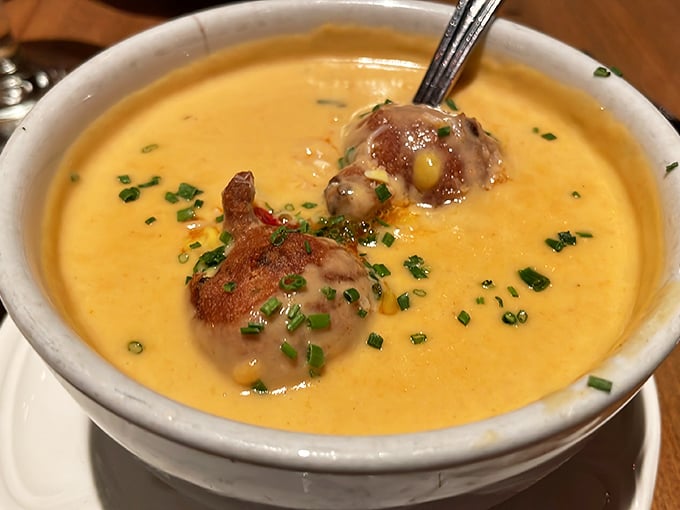 This lobster bisque doesn't just warm your stomach—it hugs your soul, with each spoonful delivering a creamy promise of coastal luxury.