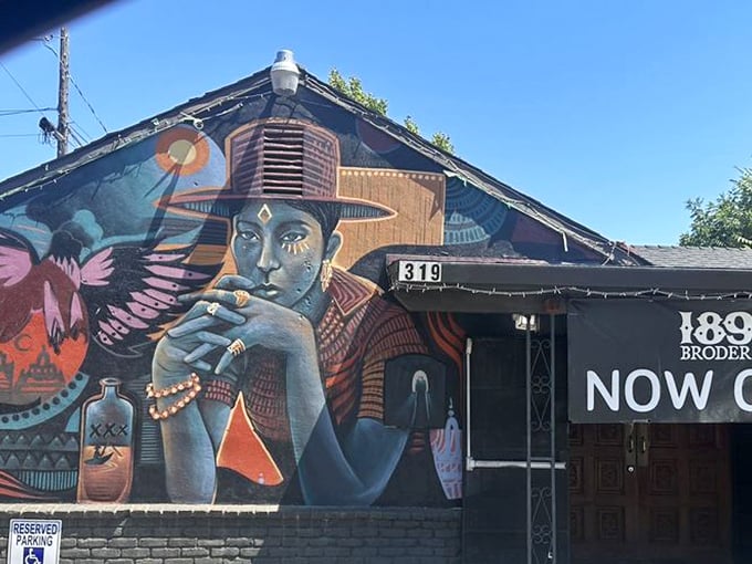 Street art meets street food at 319 Broderick. This mural doesn't just decorate—it announces that ordinary burgers need not apply.