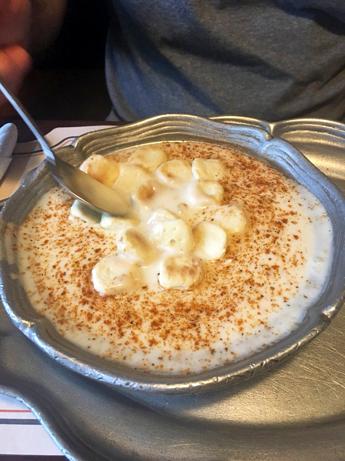 Clam chowder so creamy it should require a lifeguard on duty. That dusting of paprika isn't just garnish—it's the final brushstroke on a masterpiece.
