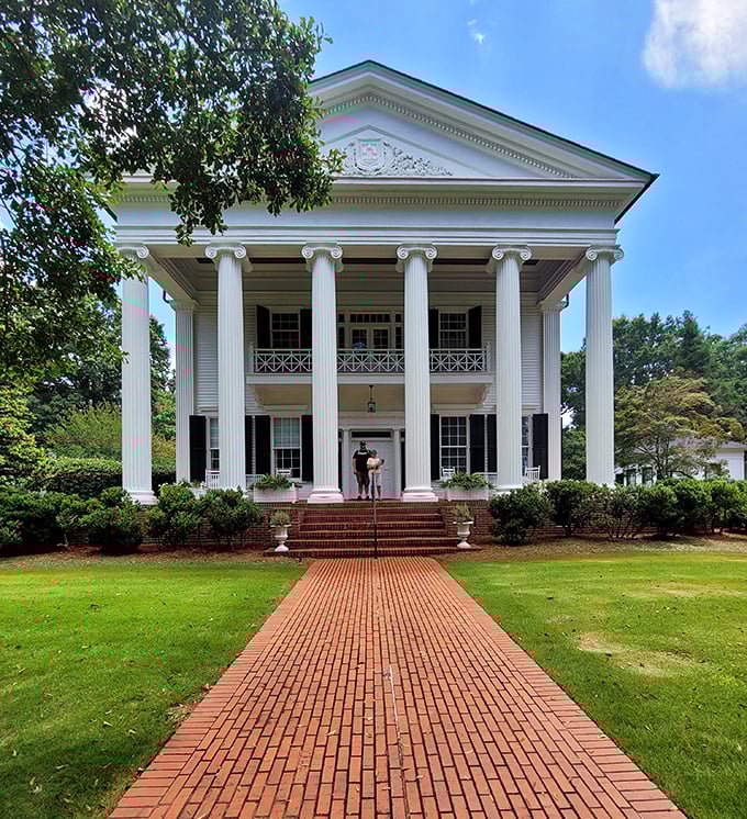 This magnificent columned mansion could make anyone feel like Scarlett O'Hara for a day – Southern grandeur that whispers stories of a bygone era.