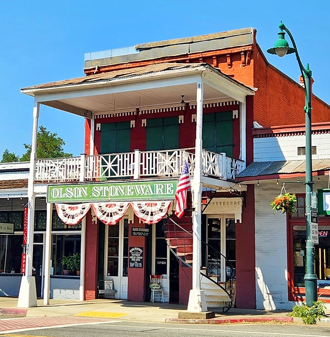 Olson Stoneware stands proudly on Main Street, where Fourth of July bunting isn't seasonal décor—it's a year-round statement of community pride.