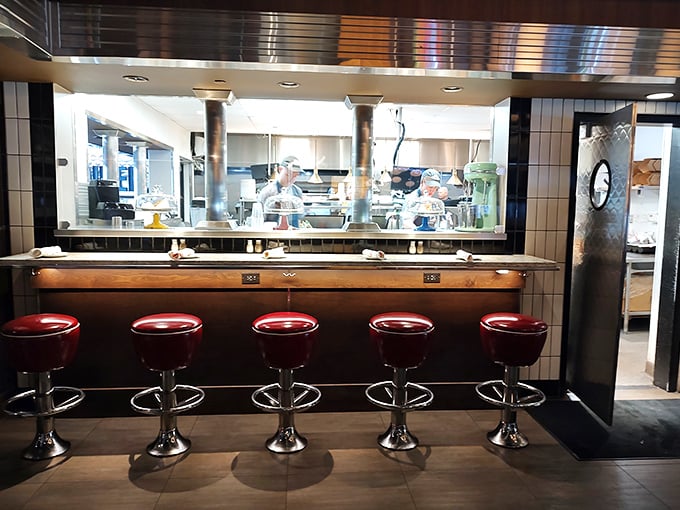 The open kitchen lets you witness culinary magic in action – dinner and a show without the awkward community theater acting.