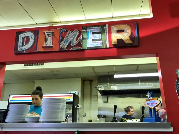 The word "DINER" in lights – because sometimes you need your breakfast with a side of theatrical flair.