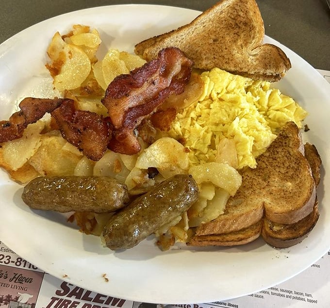 The breakfast that launched a thousand productive days—eggs, meat, potatoes, and toast in perfect harmony like a morning quartet.