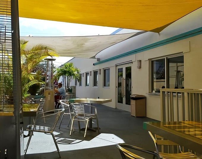 The outdoor patio—where the Florida breeze mingles with burger steam to create the perfect atmospheric conditions for serious eating.