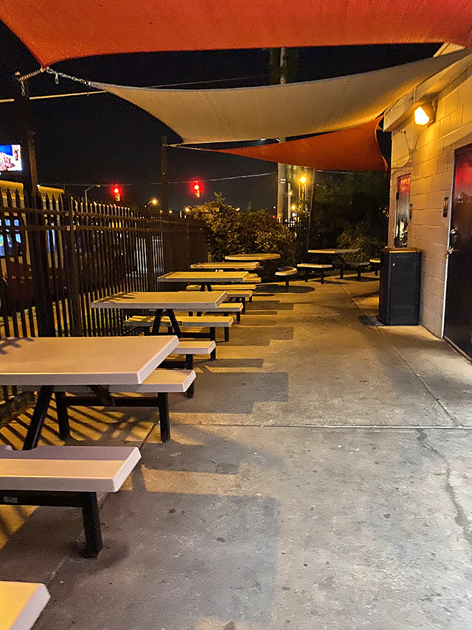 The outdoor seating area: where summer nights, cold drinks, and hot sandwiches create memories that last longer than the meal.