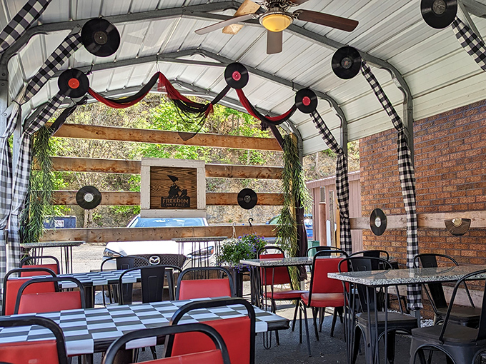 The outdoor dining area where vinyl records and checkered tablecloths create an atmosphere as satisfying as the food itself.
