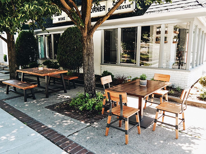 Outdoor seating where summer breezes mix with barbecue aromas. Nature's dining room for those who prefer their smoke with a side of sunshine.