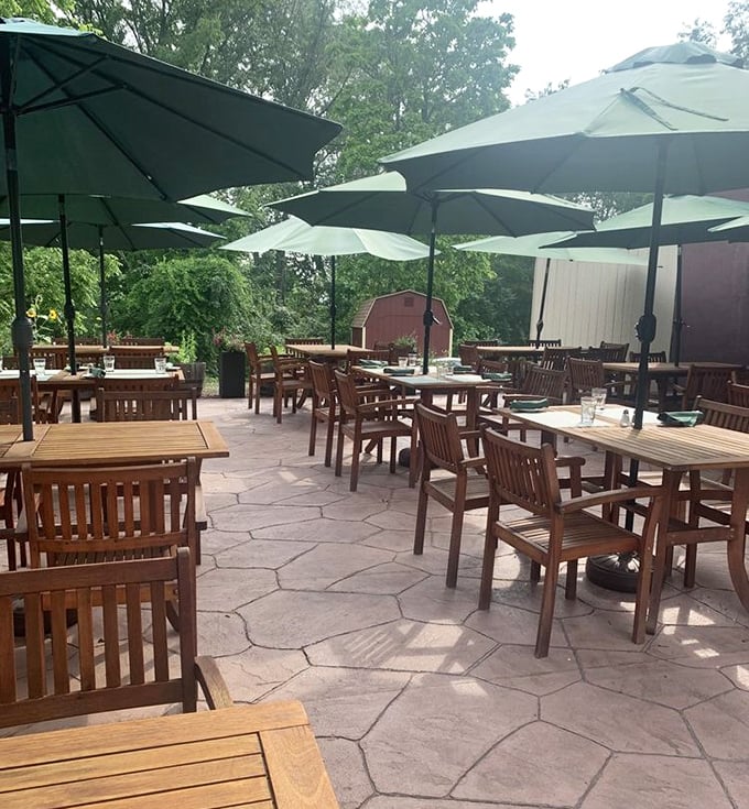 The outdoor patio where summer evenings stretch into memory under umbrellas and stars – proving great steaks taste even better with fresh air.