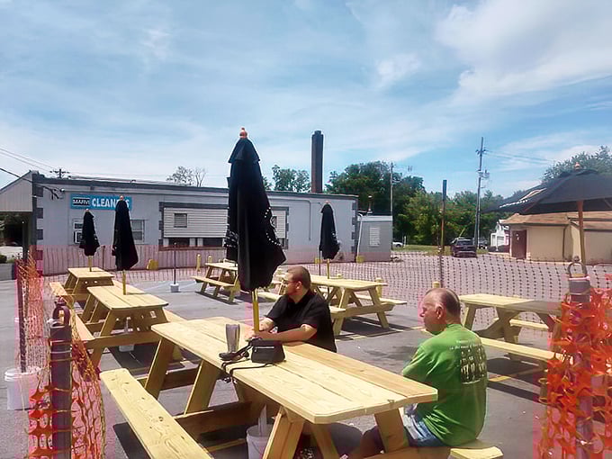 Sometimes paradise is just a wooden picnic table, good company, and the promise of a cold drink on a warm day.