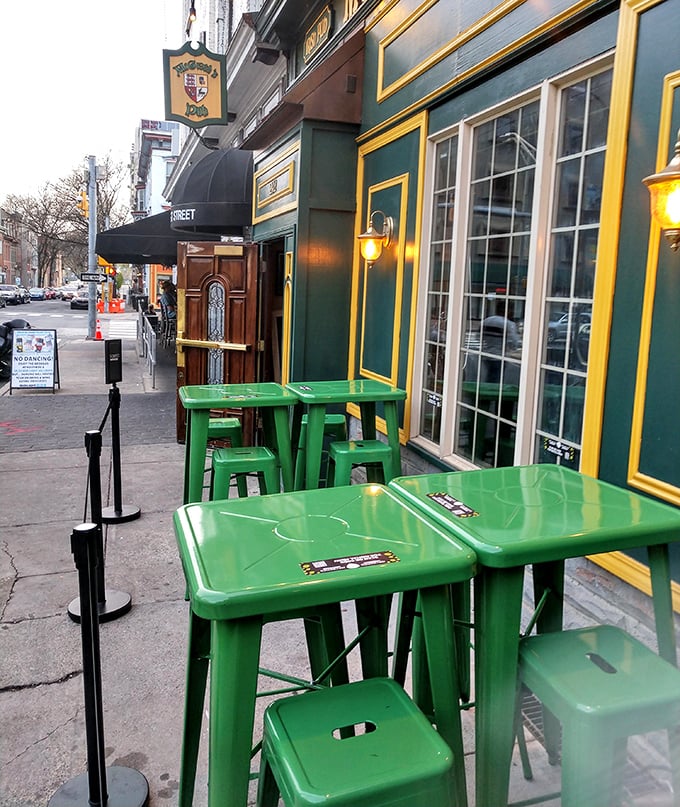 Those vibrant green tables outside aren't just furniture – they're front-row seats to Harrisburg street life and the perfect perch for people-watching with a pint.