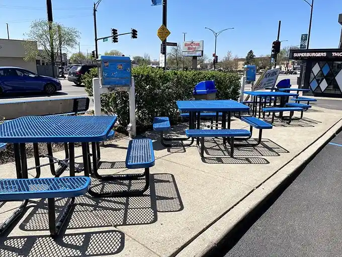 Those blue outdoor tables aren't just functional – they're front-row seats to a Chicago culinary performance that's been running for decades.