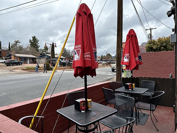 The outdoor seating area offers a front-row view of Sedona life passing by, perfect for enjoying your burger while contemplating absolutely nothing important.