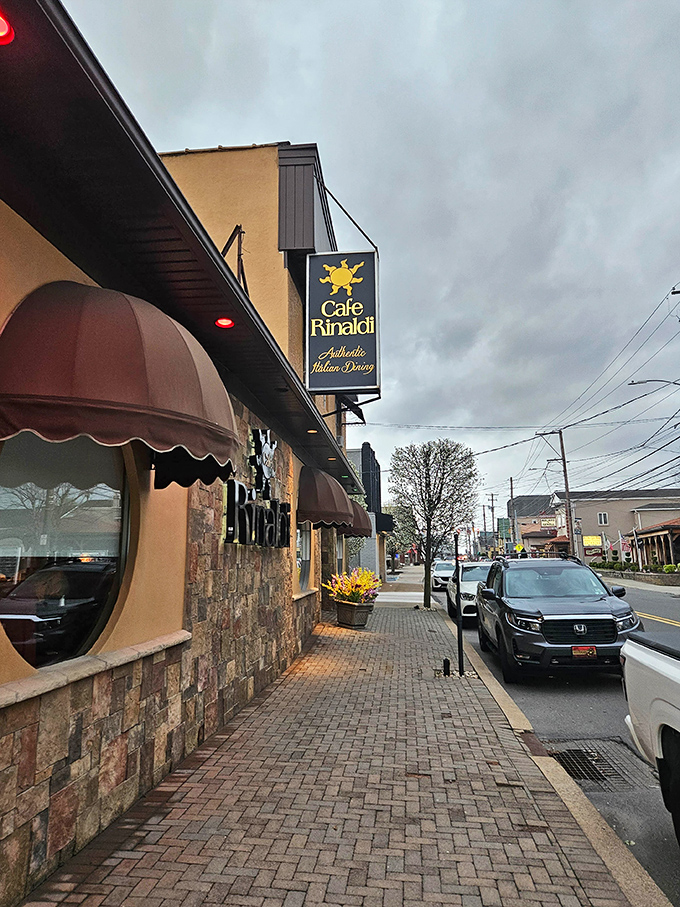 Even from the sidewalk, Café Rinaldi's warm glow spills onto the brick pavers, offering a preview of the comfort waiting inside.