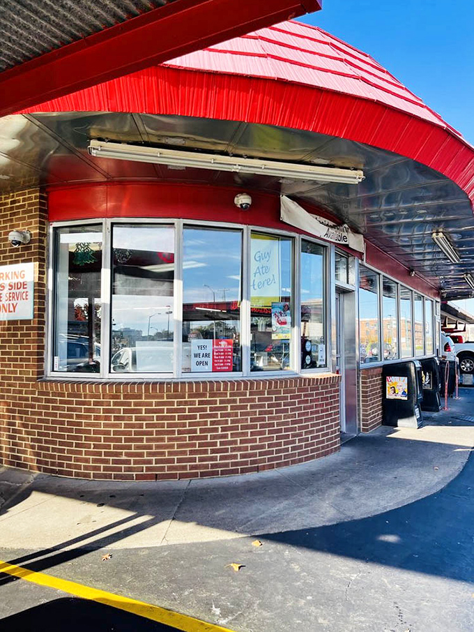 That curved brick exterior with its distinctive red awning isn't just architecture—it's a promise of consistency in a world that changes too quickly for comfort.