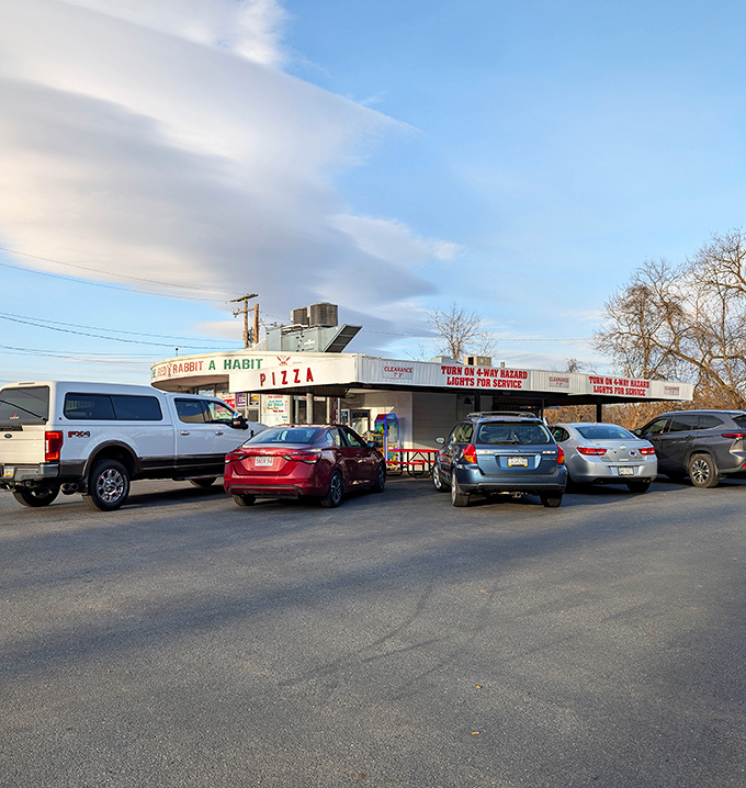 Dusk at the Red Rabbit—when the parking lot fills with a democratic mix of pickup trucks and sedans, united in pursuit of comfort food excellence.